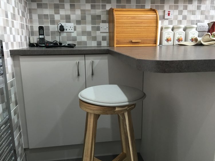 An Unusual Kitchen Layout With T Shape Breakfast Area